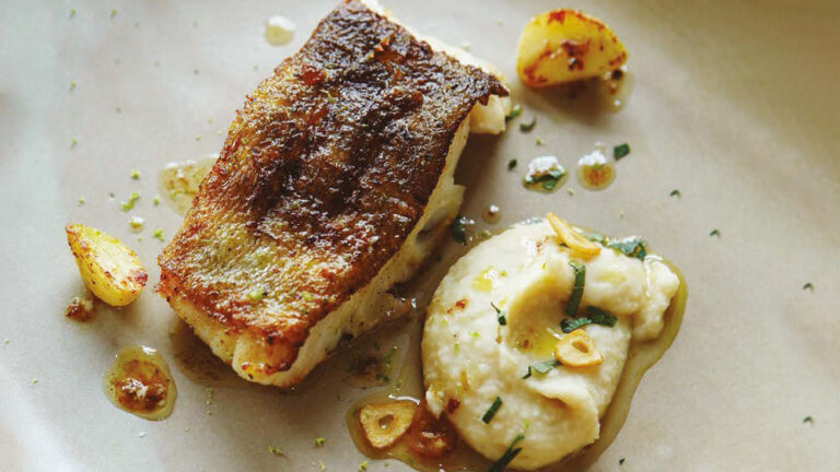 Pan fried cod loin with white bean purée & garlic crisps | Taste of France